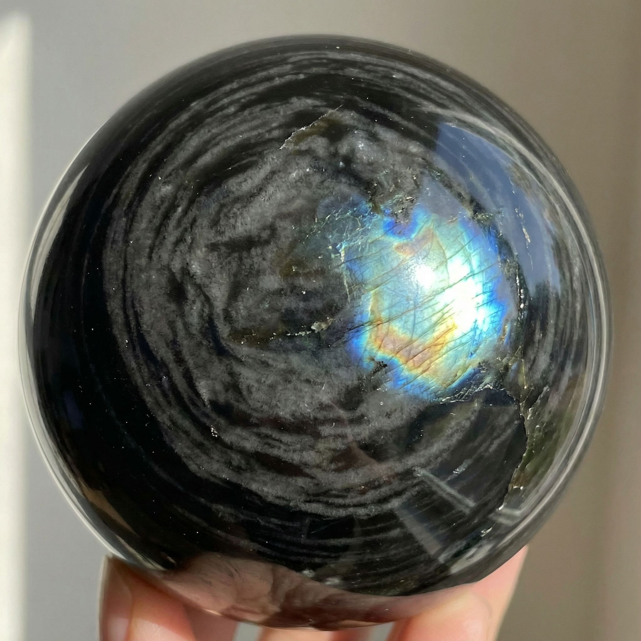 Nano Banana prompt: Black obsidian with grey whips flowin...