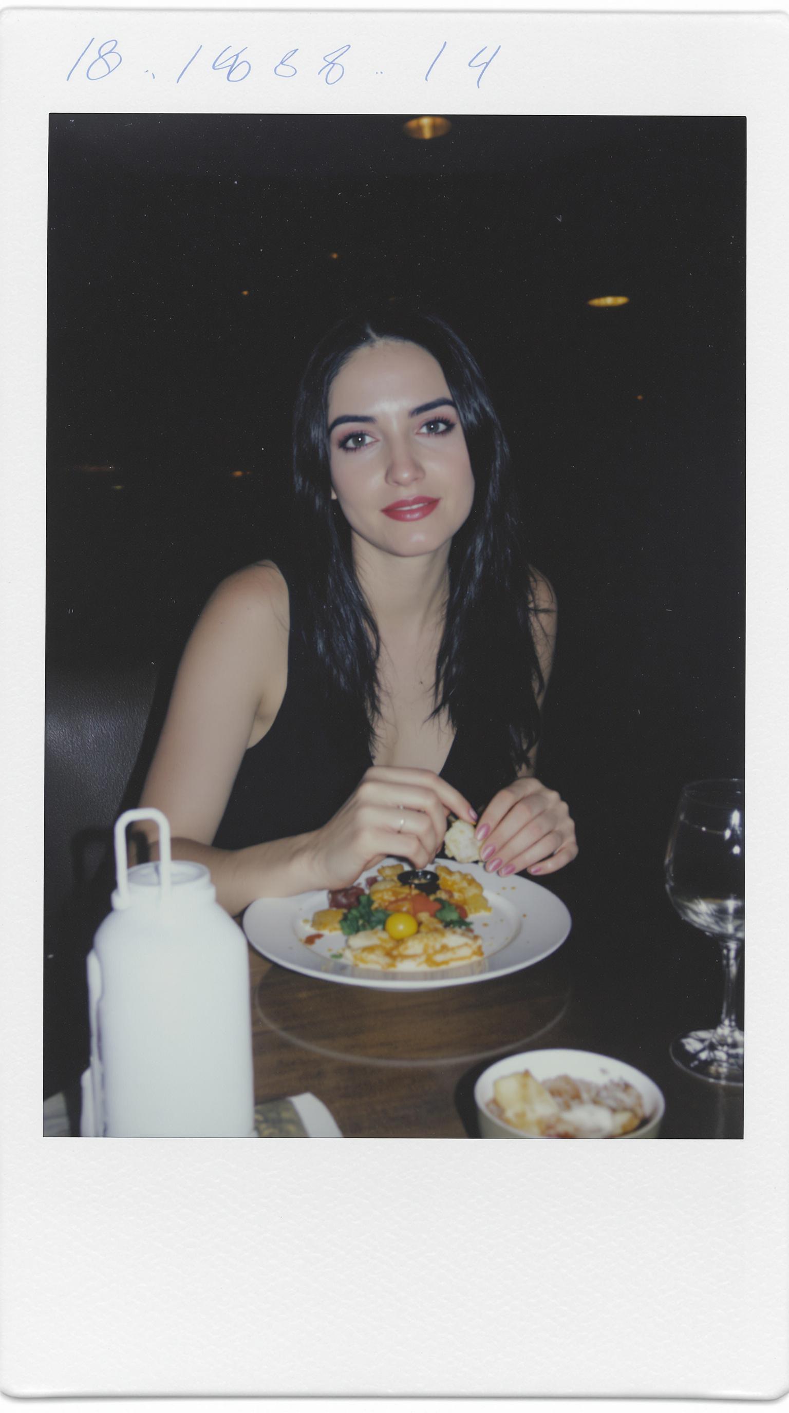 FLUX prompt: 18-year-old woman, black hair, light blue ey...