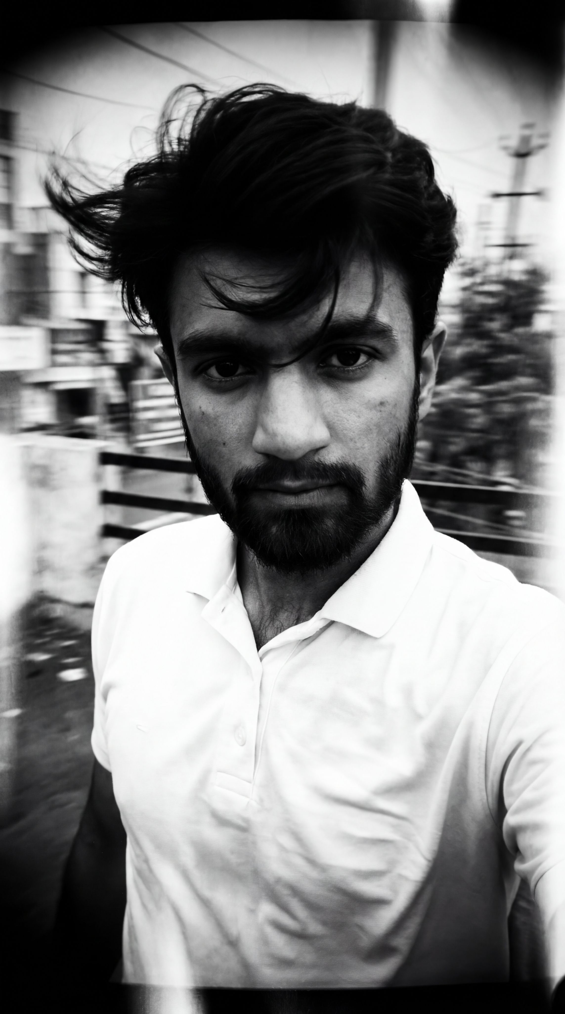 Nano Banana prompt: a man in image on a windy day, in the...